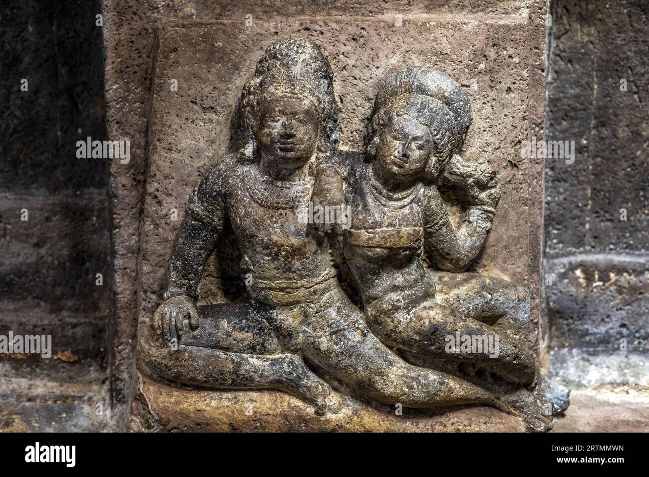 Ajanta caves, a UNESCO World Heritage Site in Maharashtra, India. Small statue in cave 16 ...