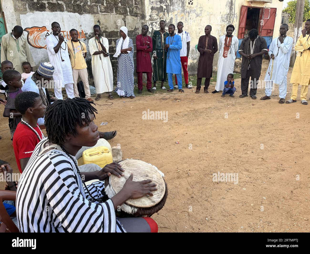 Islamic chanting and drumming outside a mosque in Ndayane, Senegal ...