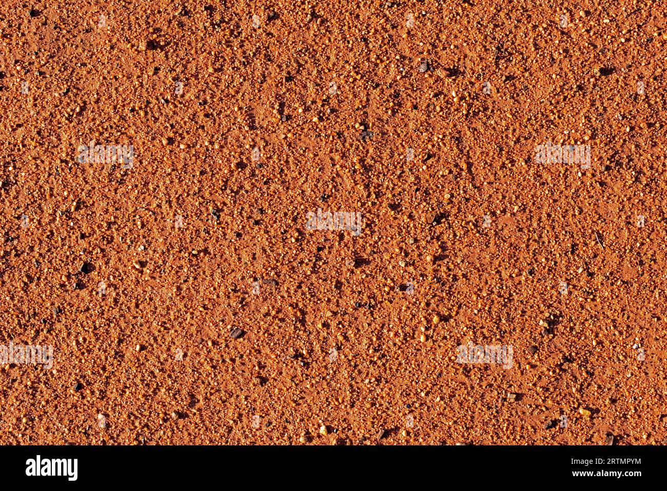 Background of red granular sand with high iron content Stock Photo - Alamy