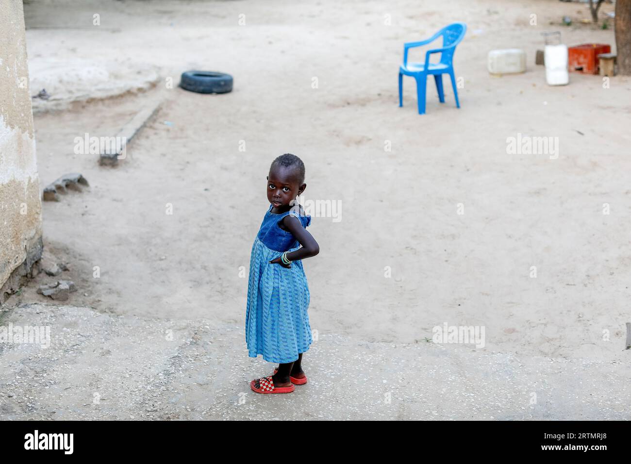 Standing girl in a village near Fatick, Senegal Stock Photo - Alamy