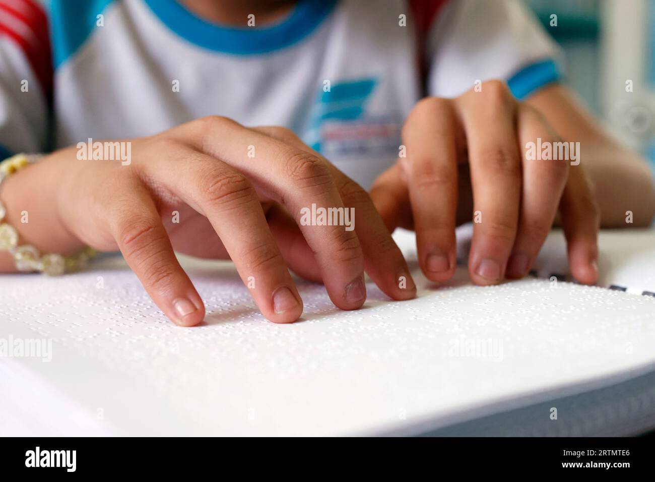 Blind girl reading braille book hi-res stock photography and images - Alamy