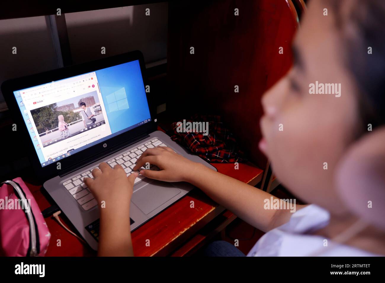 Center for blind children. Blind girl using a computer. Ho Chi Minh ...