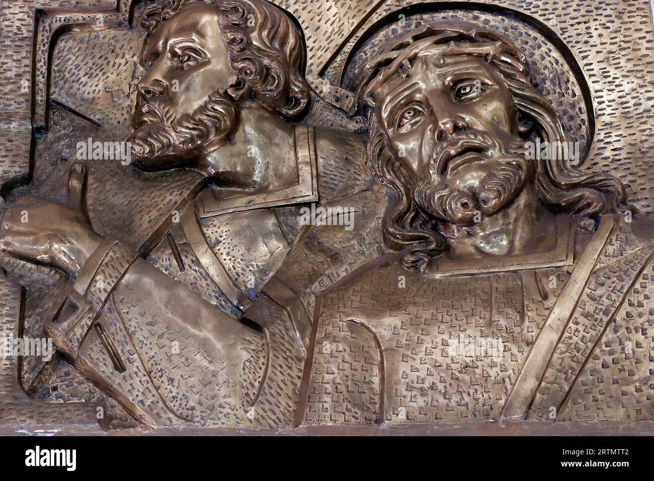 Catholic church. Way of the cross. Passion of Christ. Simon of Cyrene helps Jesus carry the ...