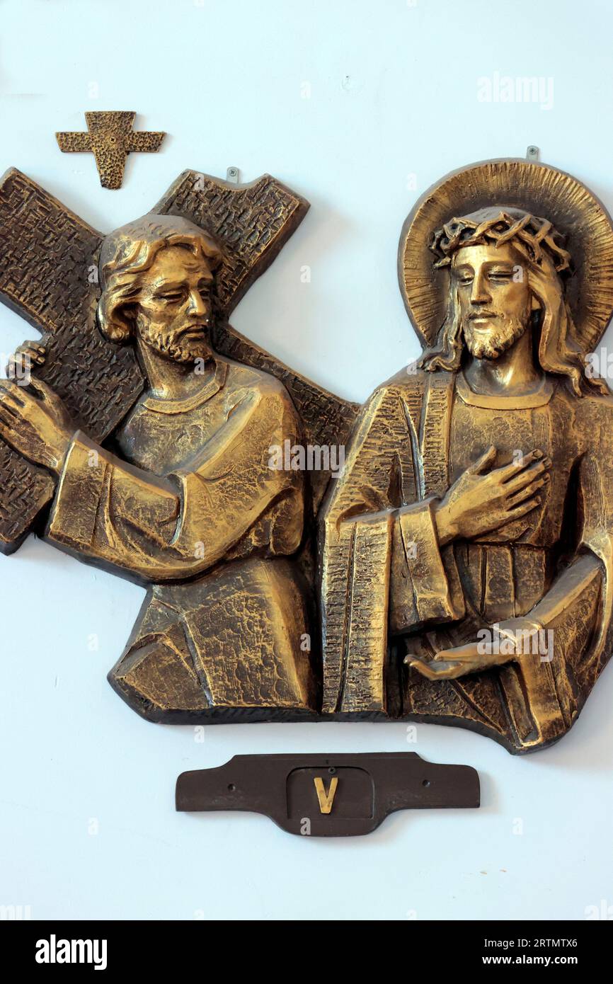 Catholic church. Way of the cross. Passion of Christ. Simon of Cyrene helps Jesus carry the ...