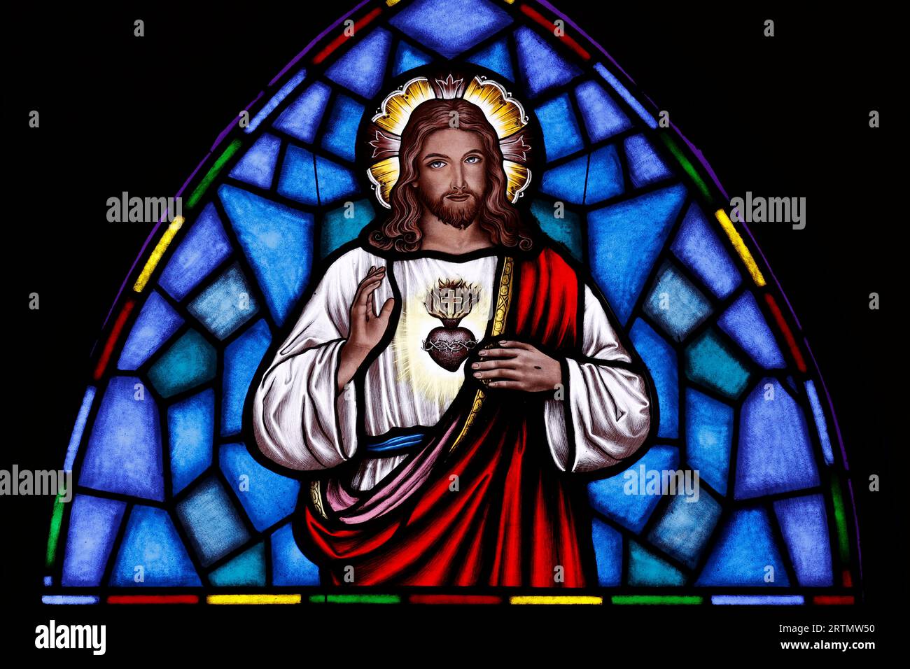 Song Vinh catholic church. Stained glass window. Jesus Christ. His wounded hand points to the ...