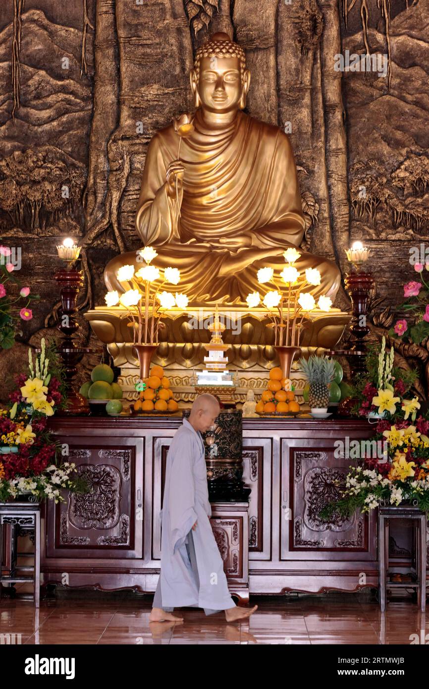 Linh Chieu Zen Monastery. Golden Buddha statue with lotus flower in ...