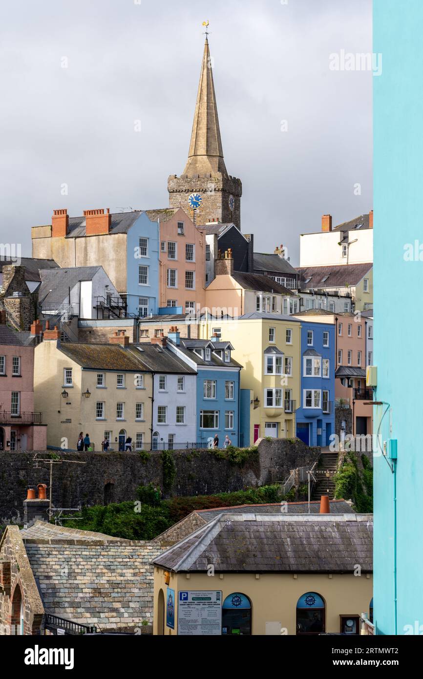 The spire of St Mary's church rises above the homes in Tenby ...