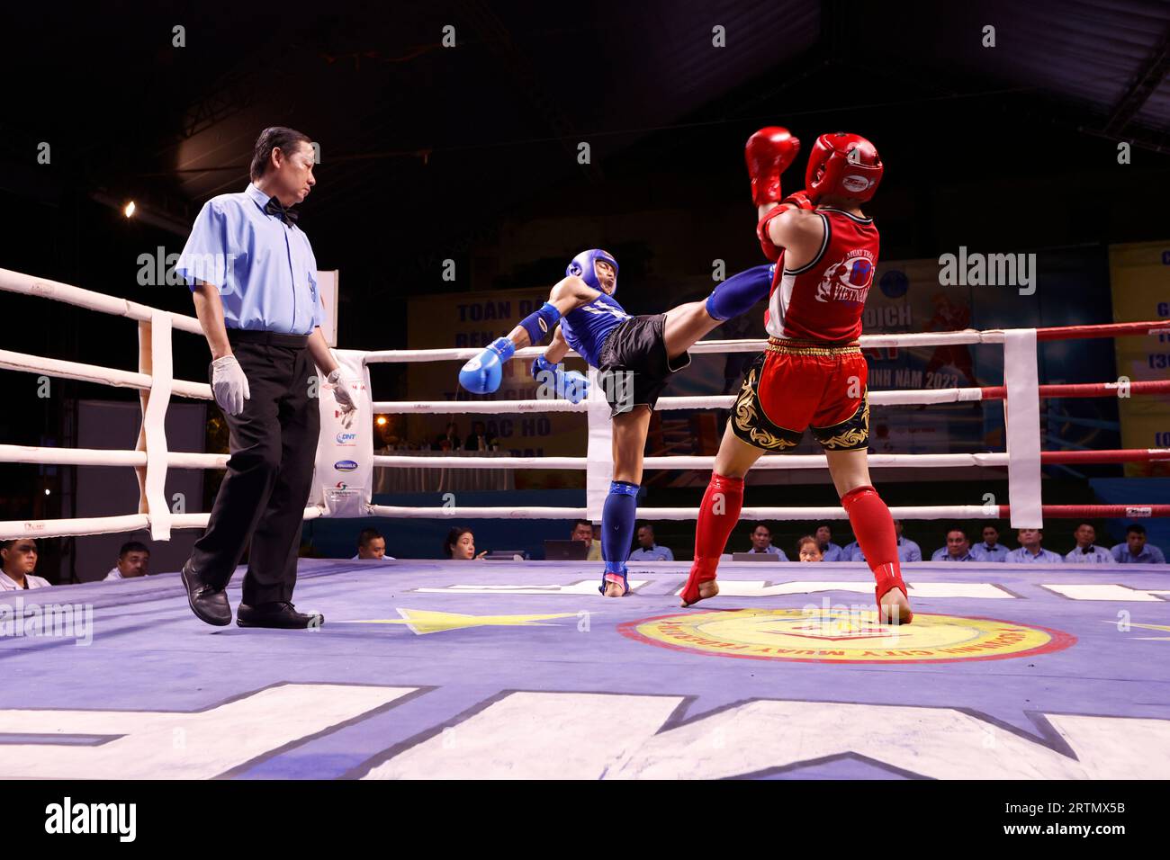 Muay Thai, Thai boxing, two men fighting in the boxing ring. Ho Chi ...