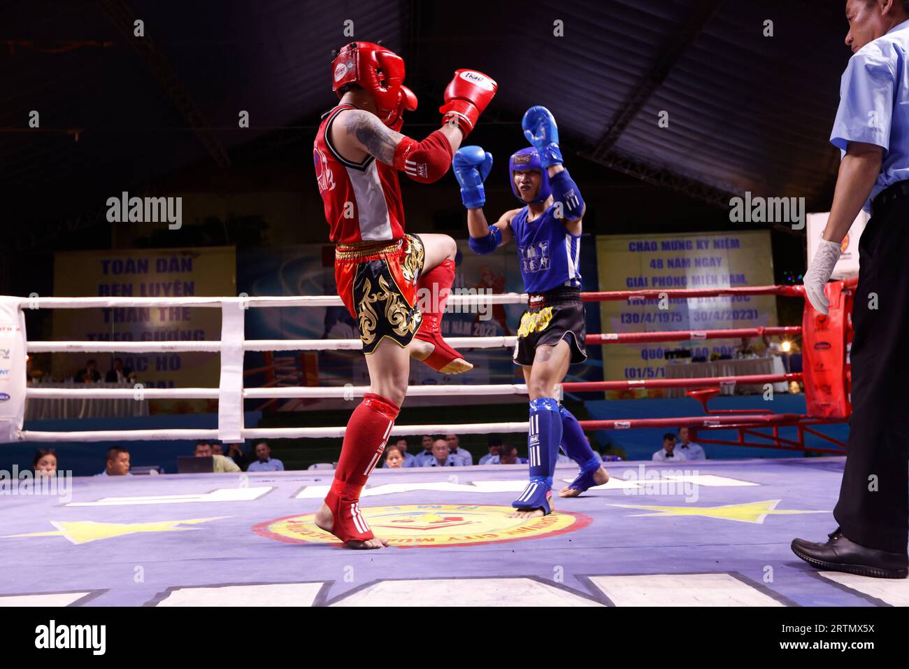 Muay Thai, Thai boxing, two men fighting in the boxing ring. Ho Chi ...