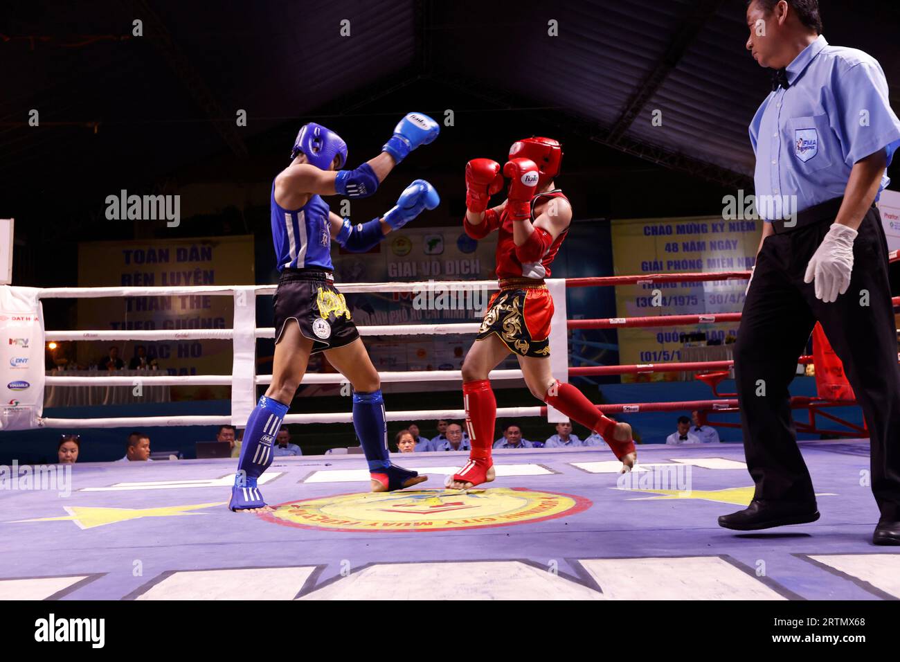 Muay Thai, Thai boxing, two men fighting in the boxing ring. Ho Chi ...