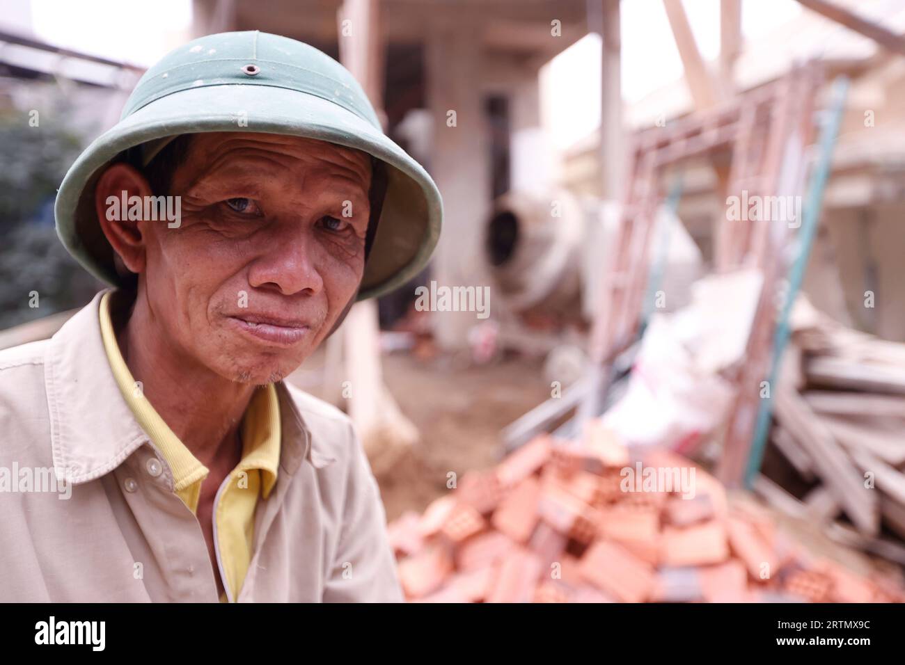 Construction site. Worker with Bo Doi helmet. Dalat. Vietnam Stock ...