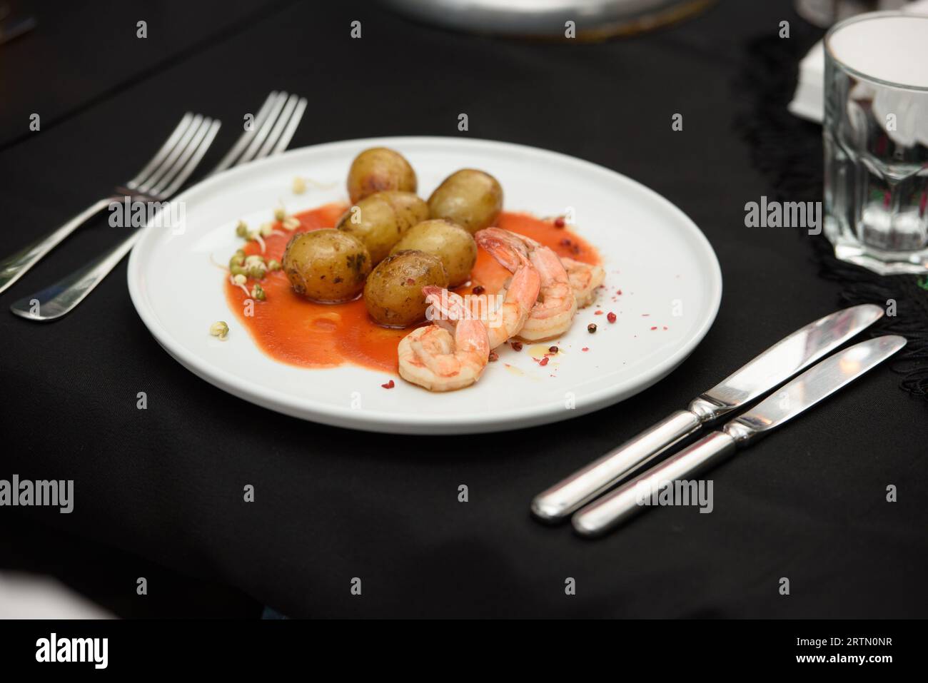 ready to eat traditional spanish tapas served on plates on black table ...
