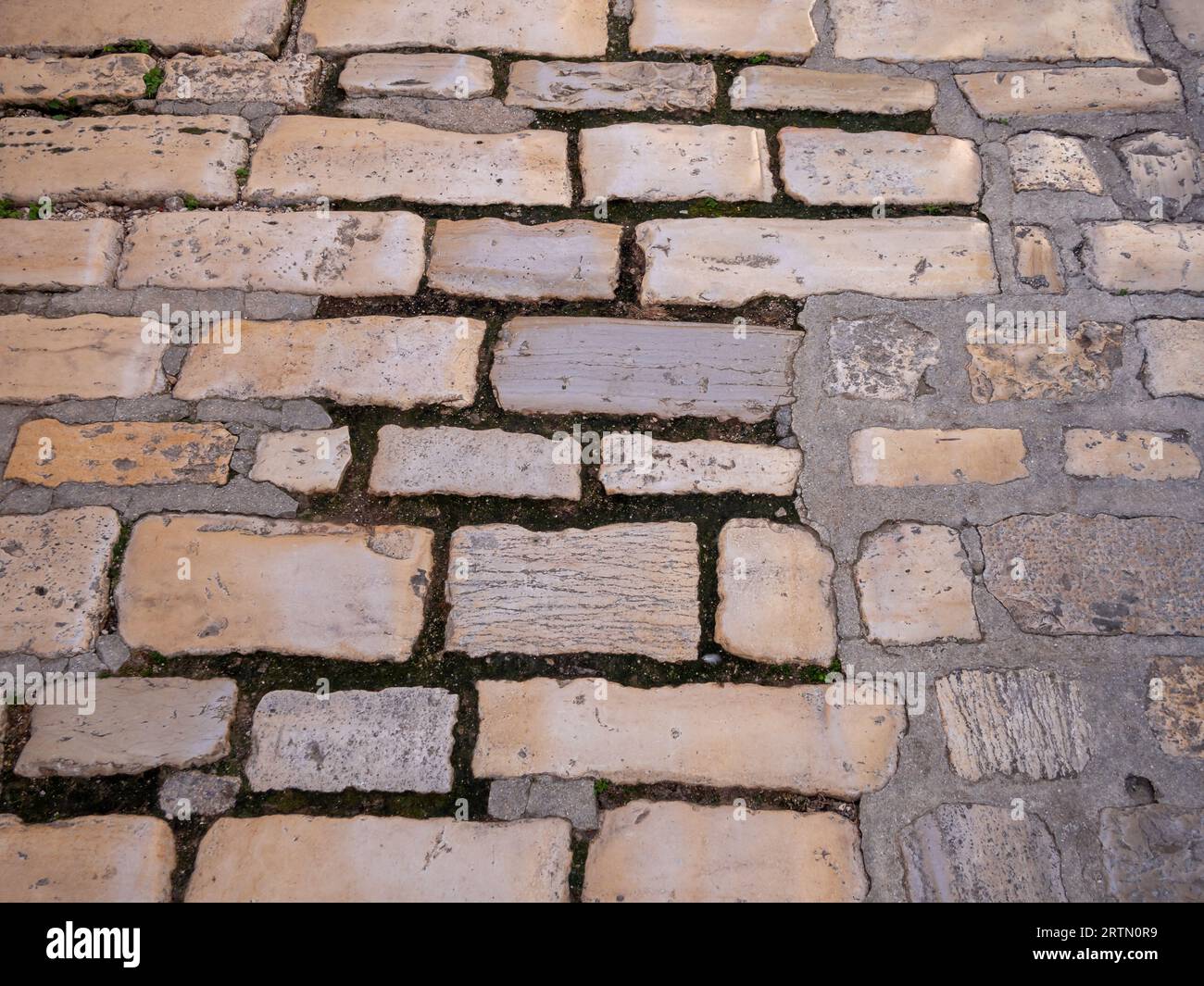 Old path with natural stone paving in the old town Stock Photo - Alamy