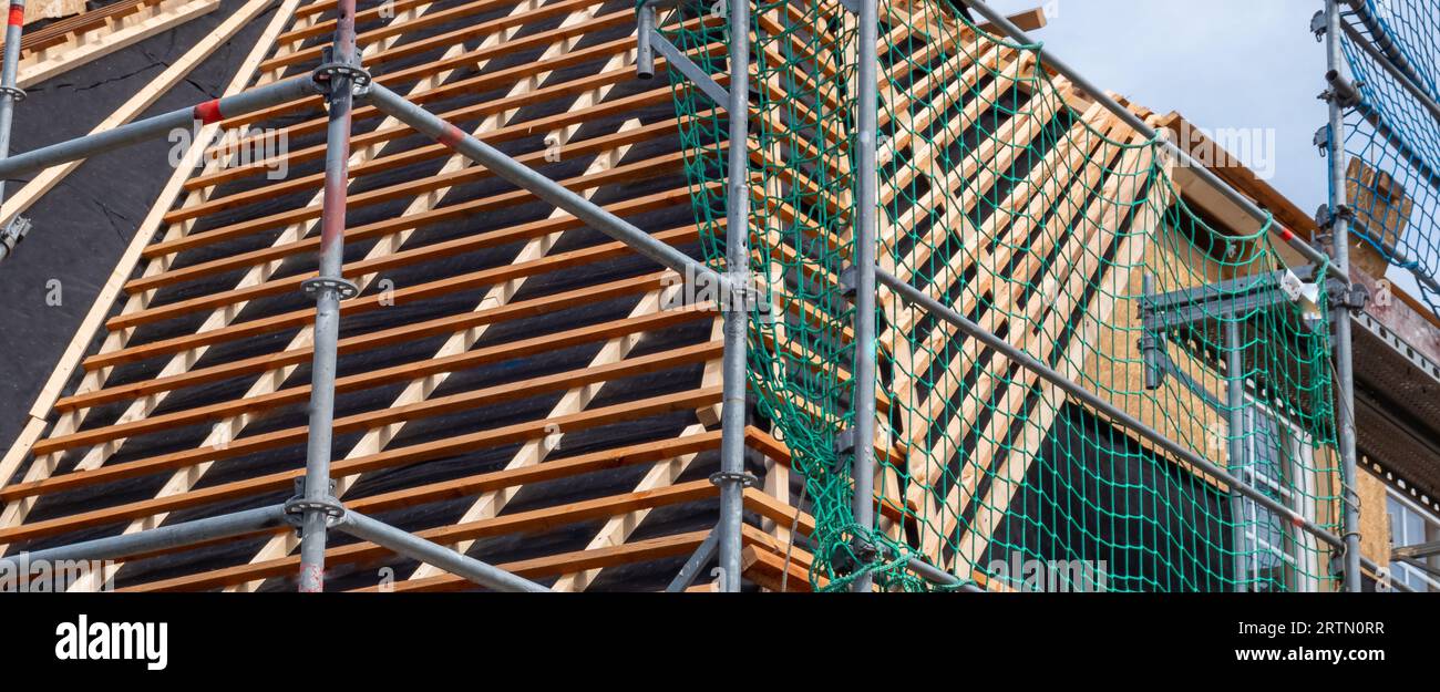 New construction of a roof with scaffolding and roof tiles Stock Photo ...