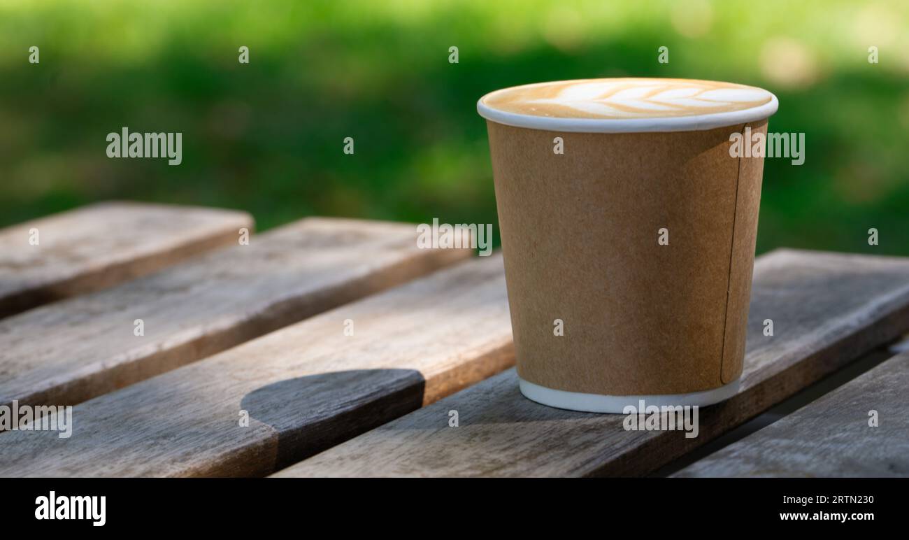 Park Perfection: Enjoying a Latte in a Paper Cup, Crisp Details Stock ...