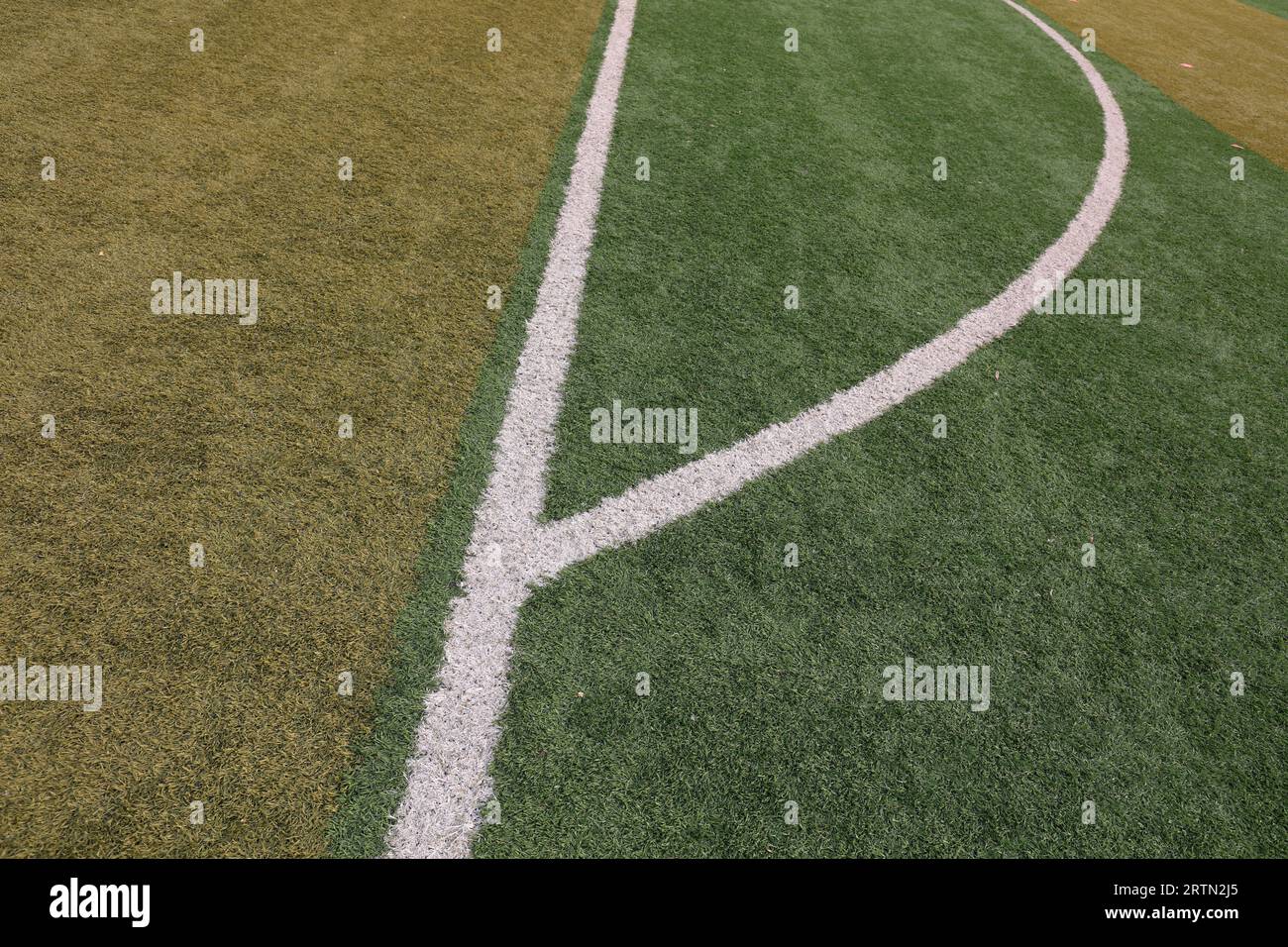white curve on the green plastic playground Stock Photo - Alamy