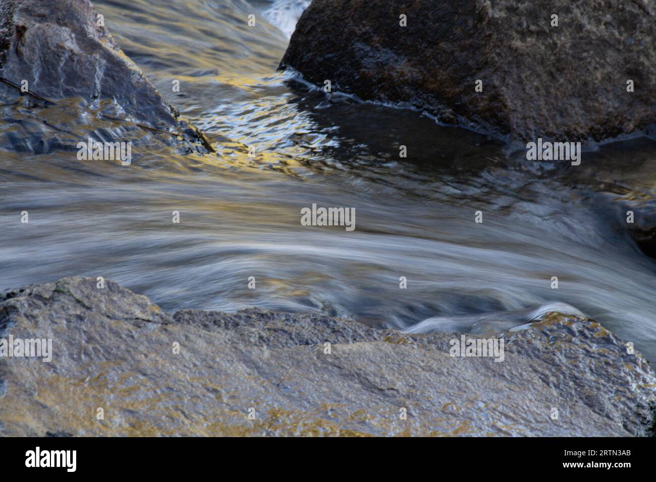 Water running over rocks Stock Photo - Alamy