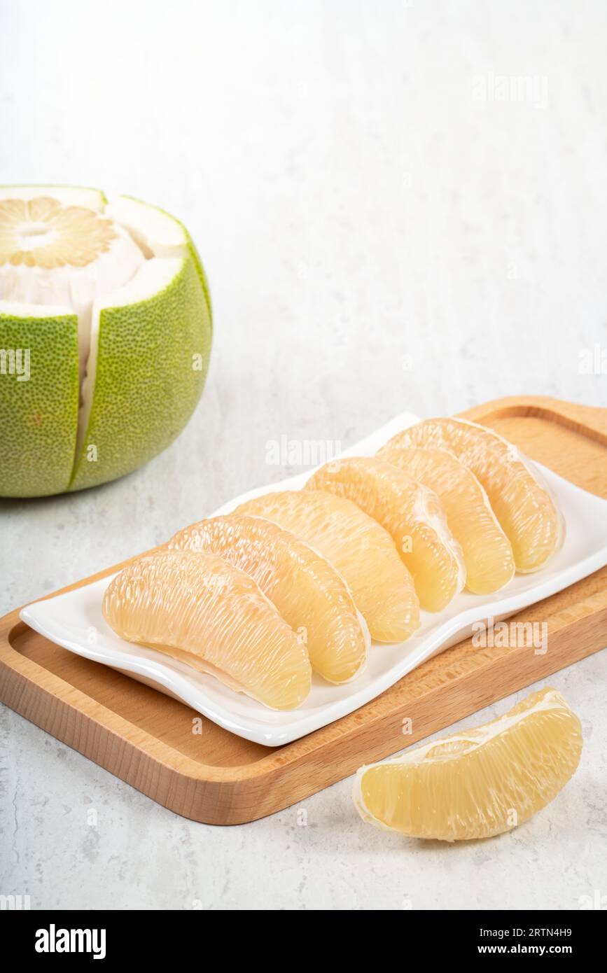 Fresh peeled pomelo on gray table background for Mid-Autumn Festival ...