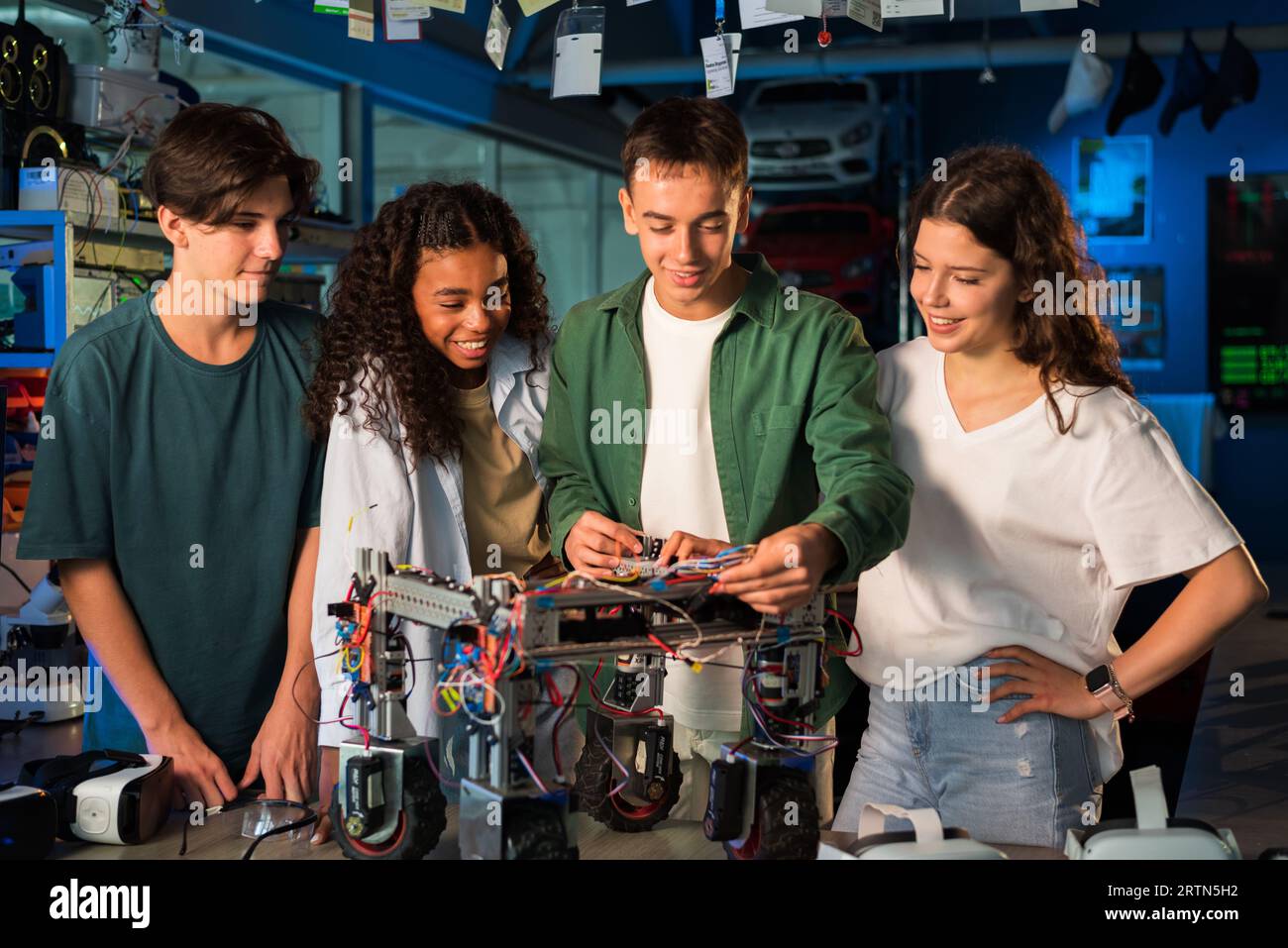 Group young people doing experiments hi-res stock photography and ...