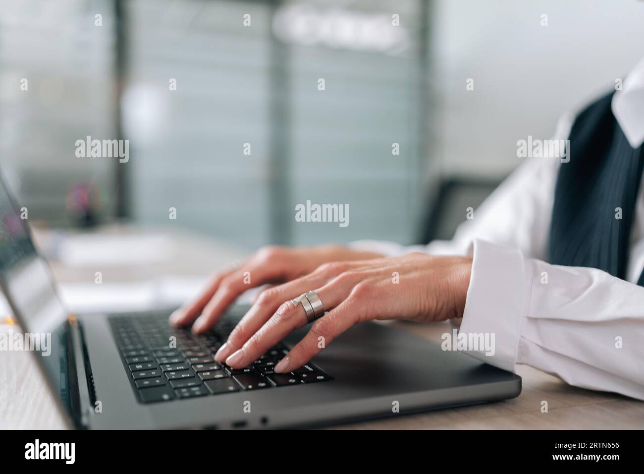 Closeup hands of unrecognizable middle-aged businesswoman working ...