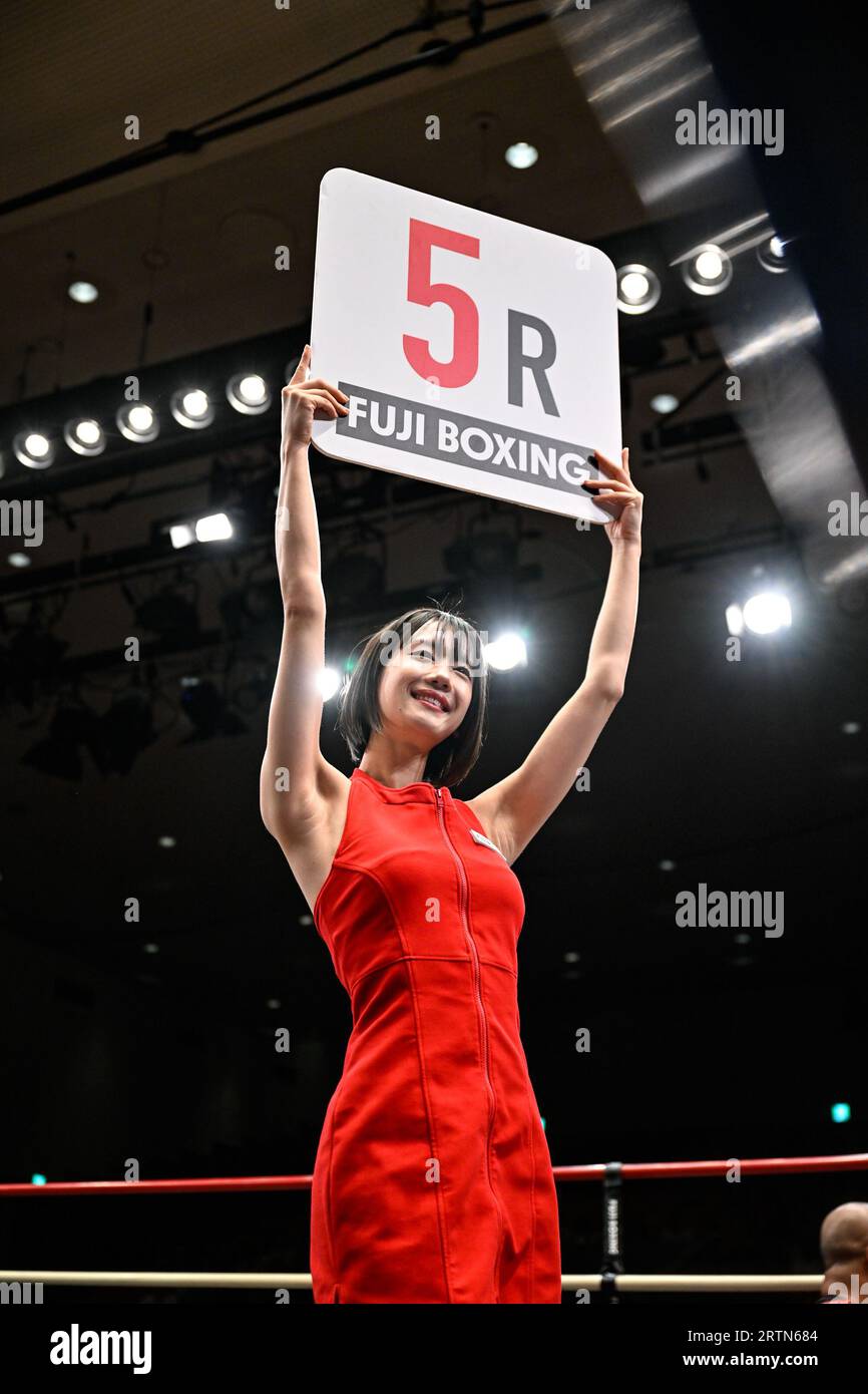 Tokyo, Japan. 12th Sep, 2023. Ring girl Yui Arata displays a fifth round sign during a boxing ...