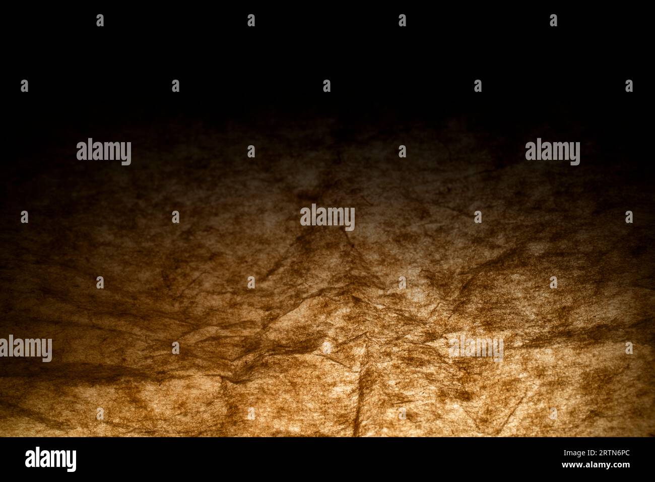 Background image of warm-toned paper texture degrading to black towards ...