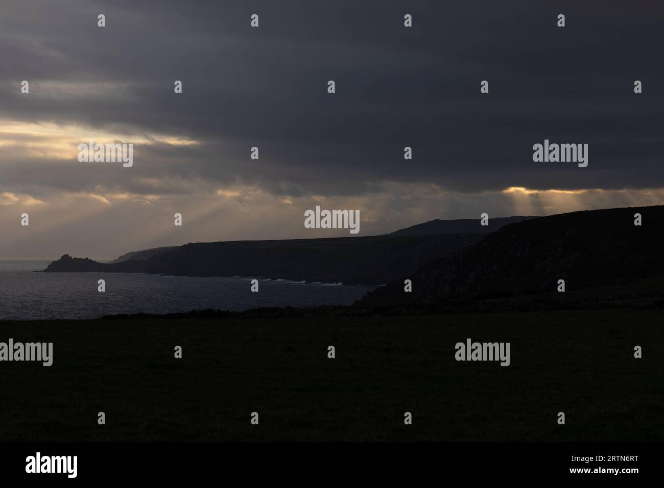 Pendeen Head view to Gurnard's Head Cornwall sun rays at dawn August ...