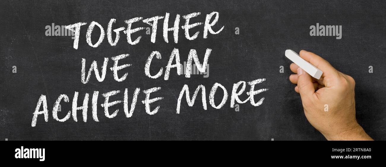 Text written on a blackboard - Together we can achieve more Stock Photo ...