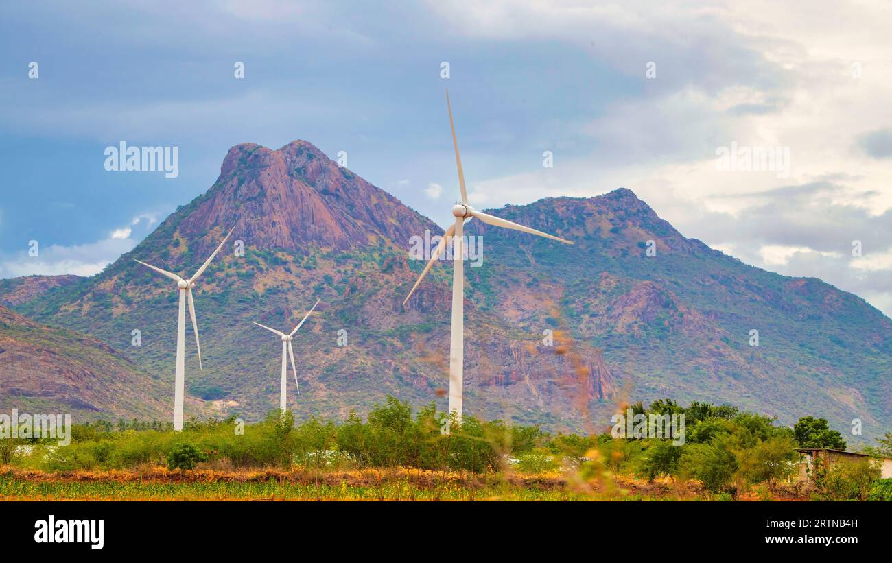 Windmill - Wind turbine below the mountain on the agriculture land ...
