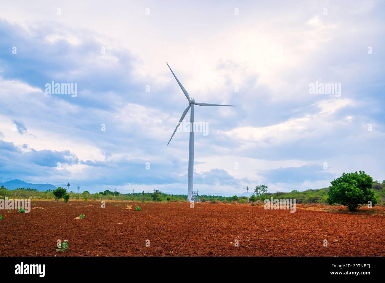 Windmill - Wind turbine below the mountain on the agriculture land ...