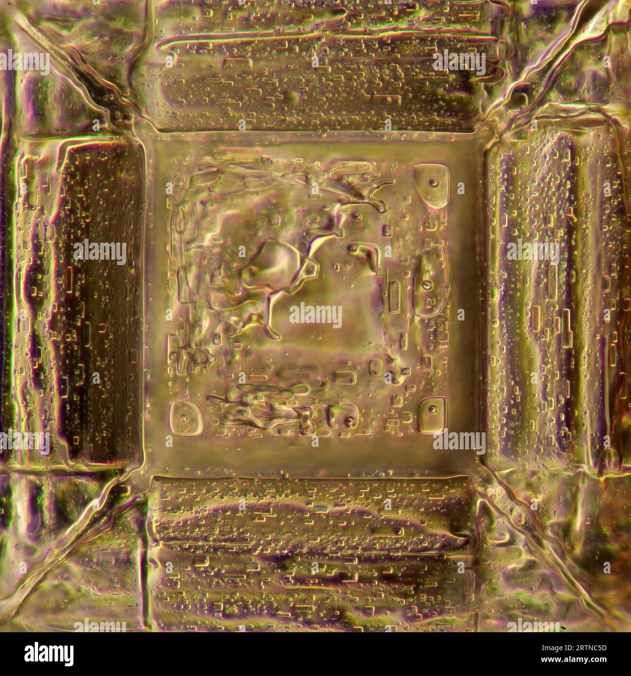 The image presents a single crystal of recrystallized kitchen salt ...
