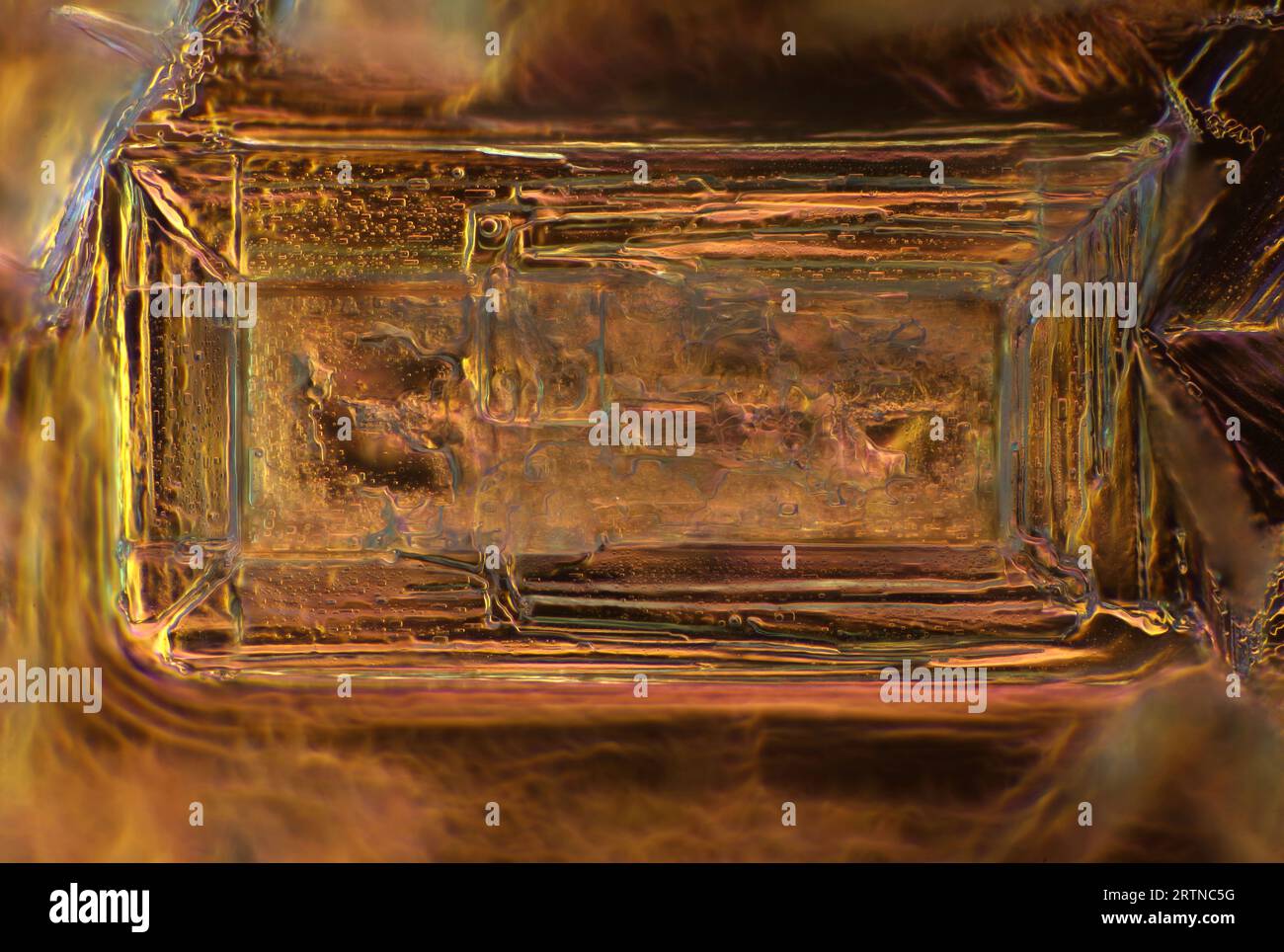 The image presents a single crystal of recrystallized kitchen salt ...