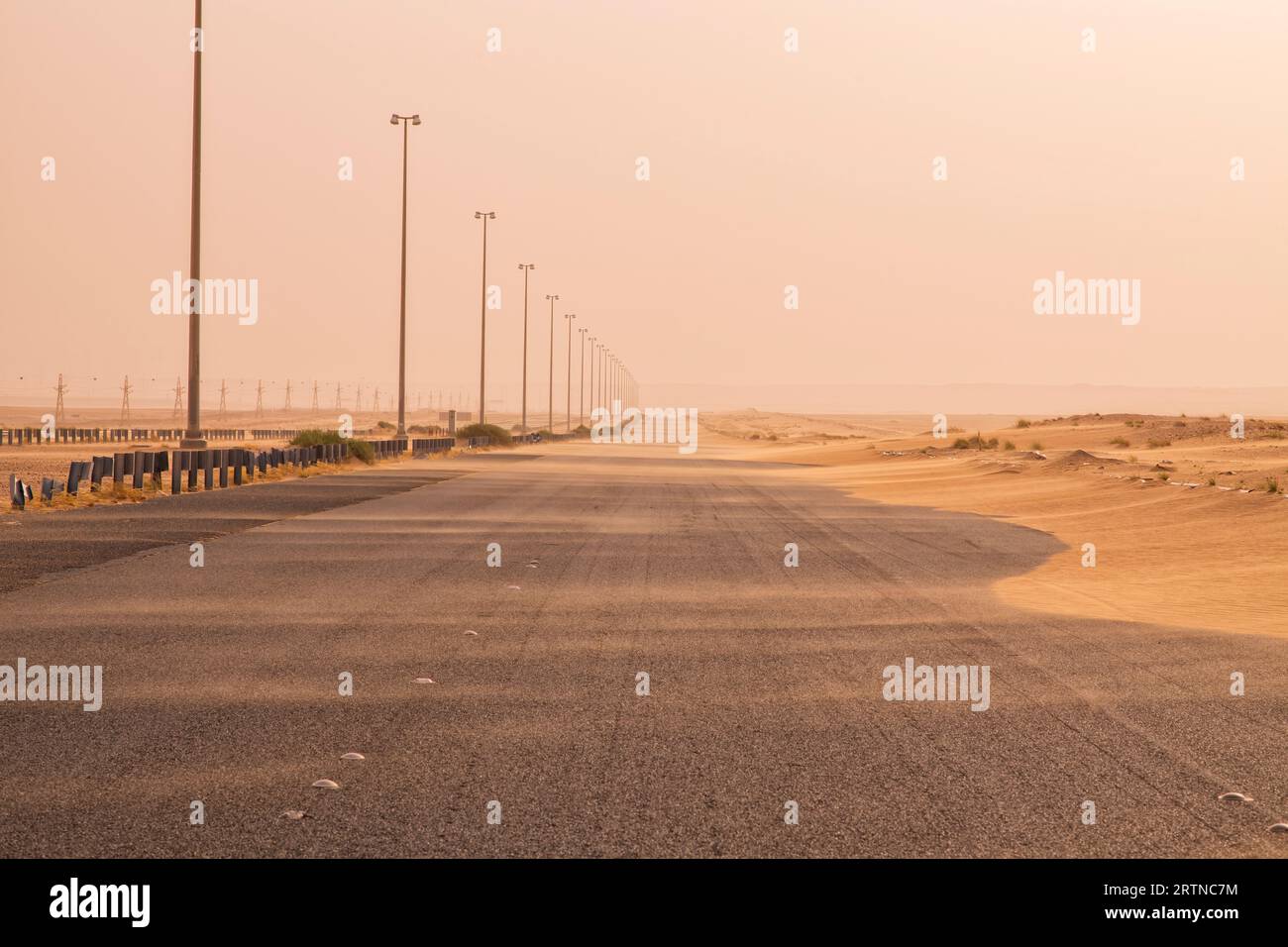 Roads are covered with desert sand after sand storm. No place for ...