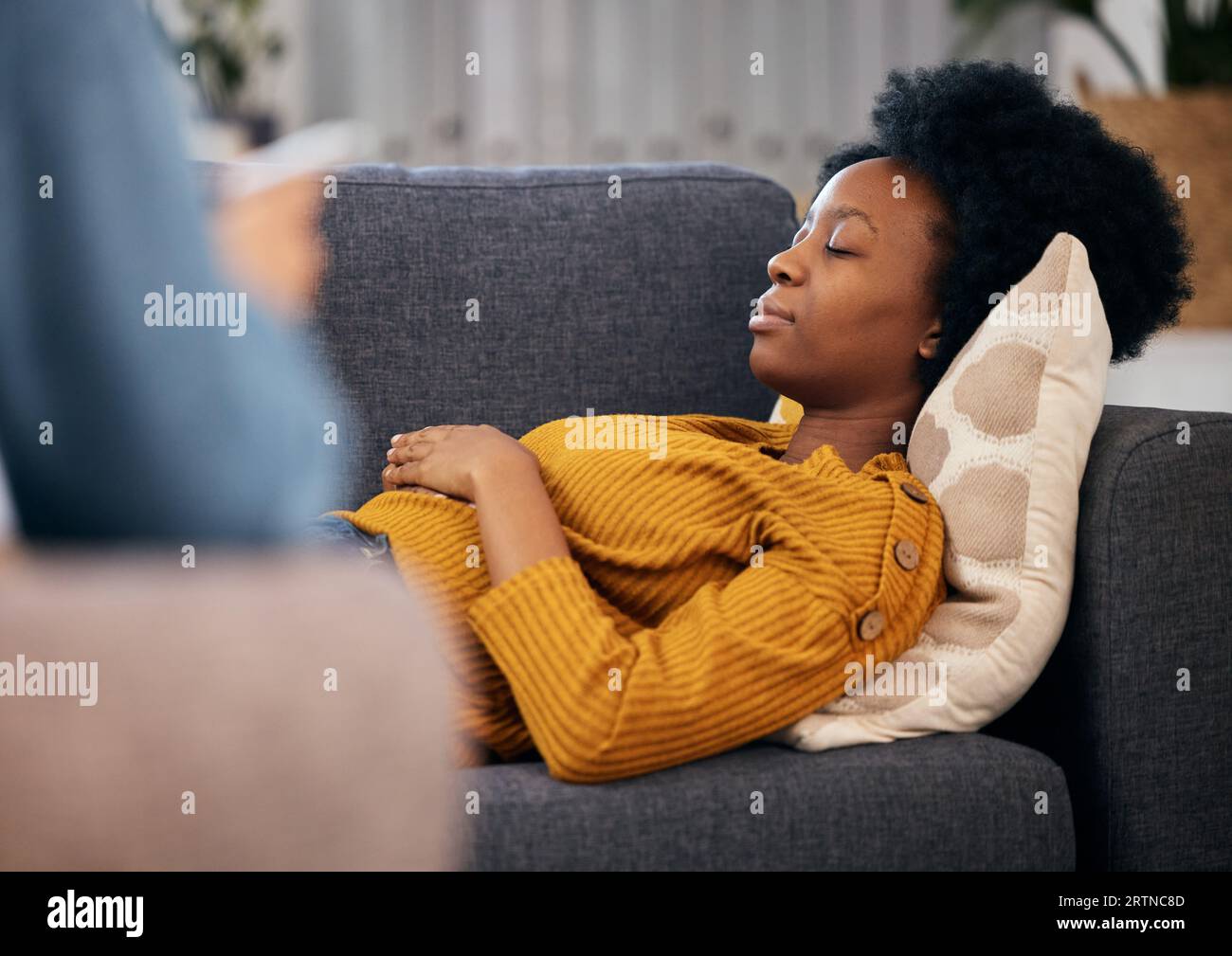 Therapy, sofa and black woman relax in consultation for mental health ...