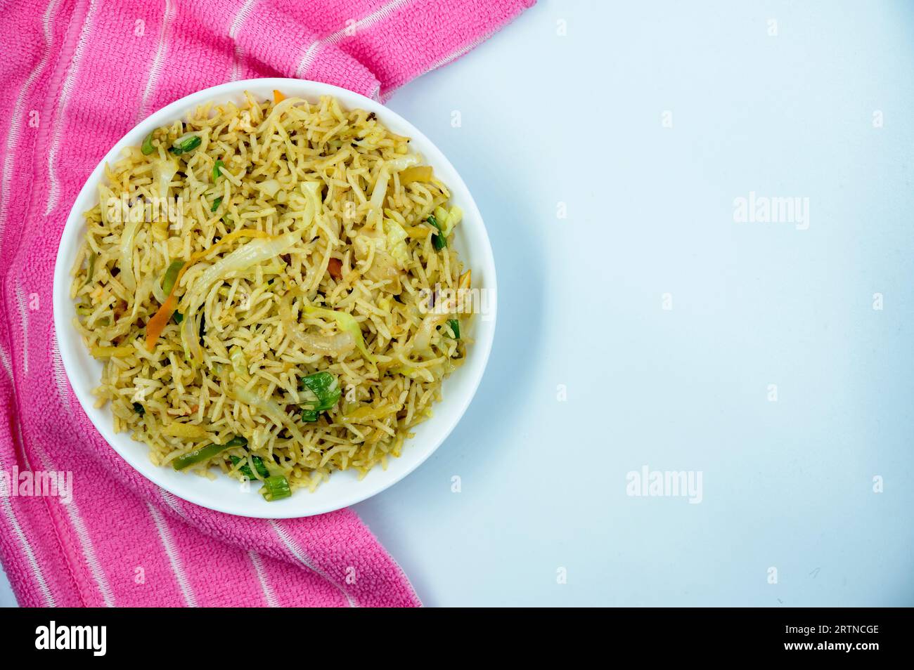 Indian vegetarian pulao or Veg fried rice or Veg Briyani in brown ...