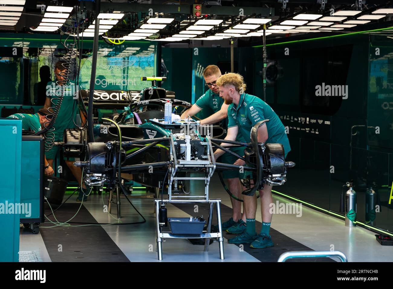 Aston Martin F1 Team AMR23, mechanical detail of mechanics working in ...