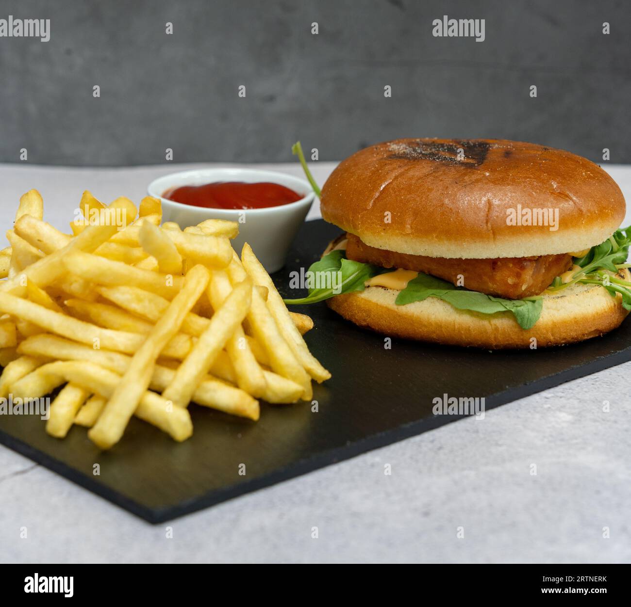 Delicious fast food burgers, MEGA Burger fries ketchup Stock Photo - Alamy