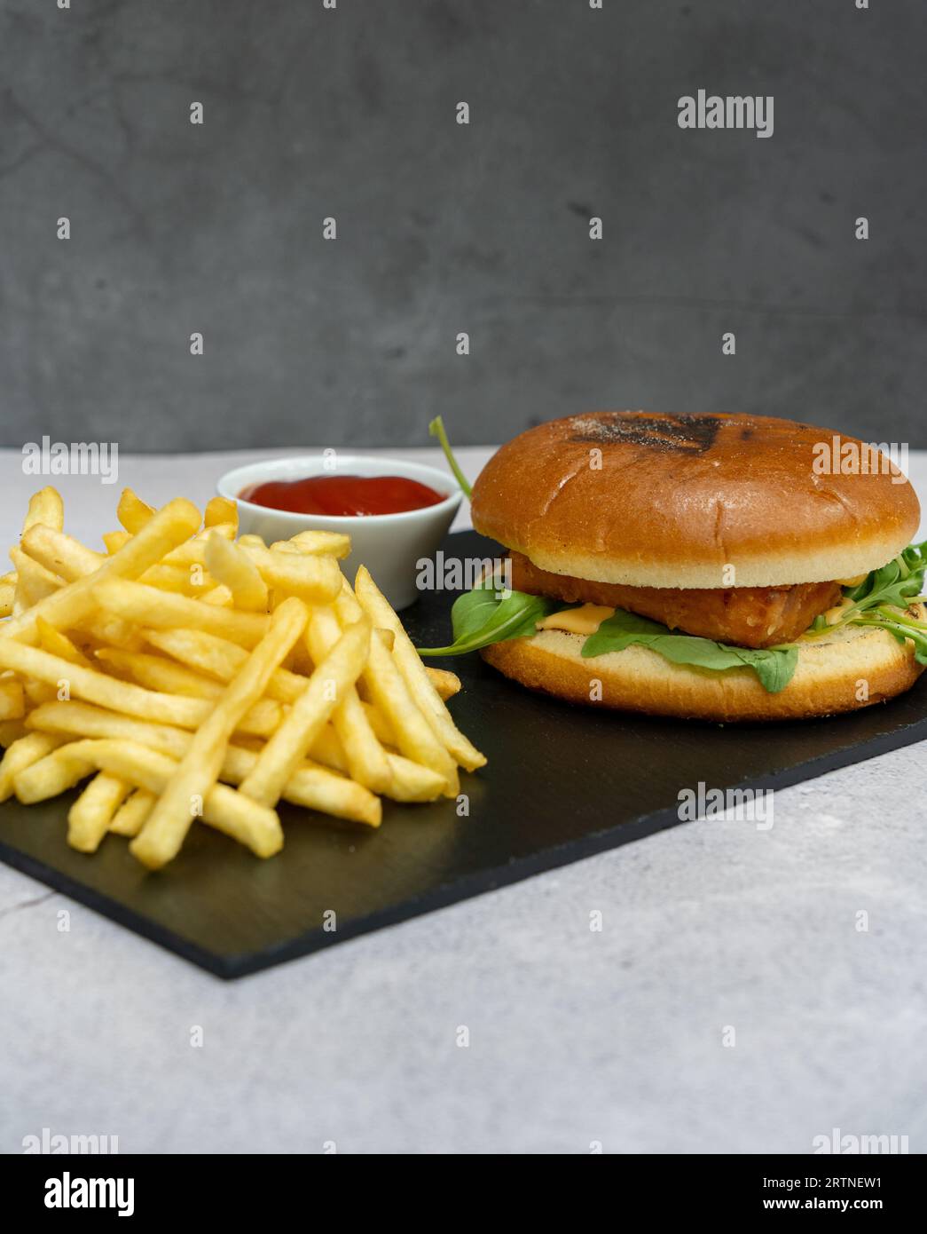 Delicious fast food burgers, MEGA Burger fries ketchup Stock Photo - Alamy