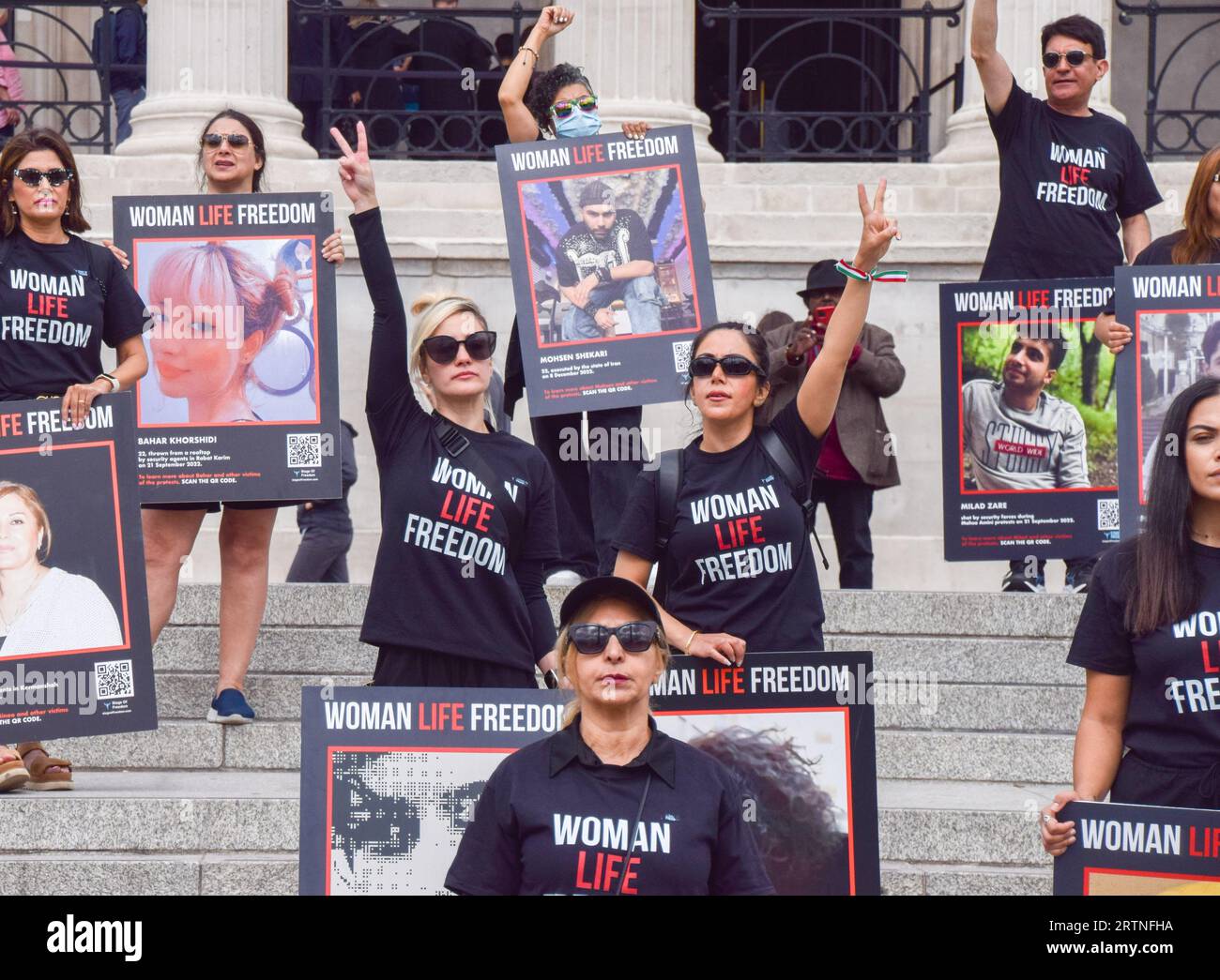 London, UK. 13th Sep, 2023. Protesters hold pictures of Mahsa Amini and ...