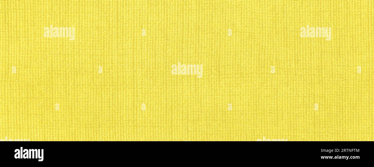 Light yellow background from a textile material with pattern, closeup ...