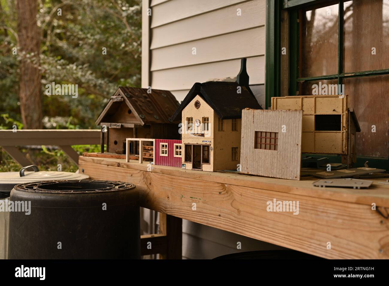 A group of miniature buildings on a table, brightly colored and ...