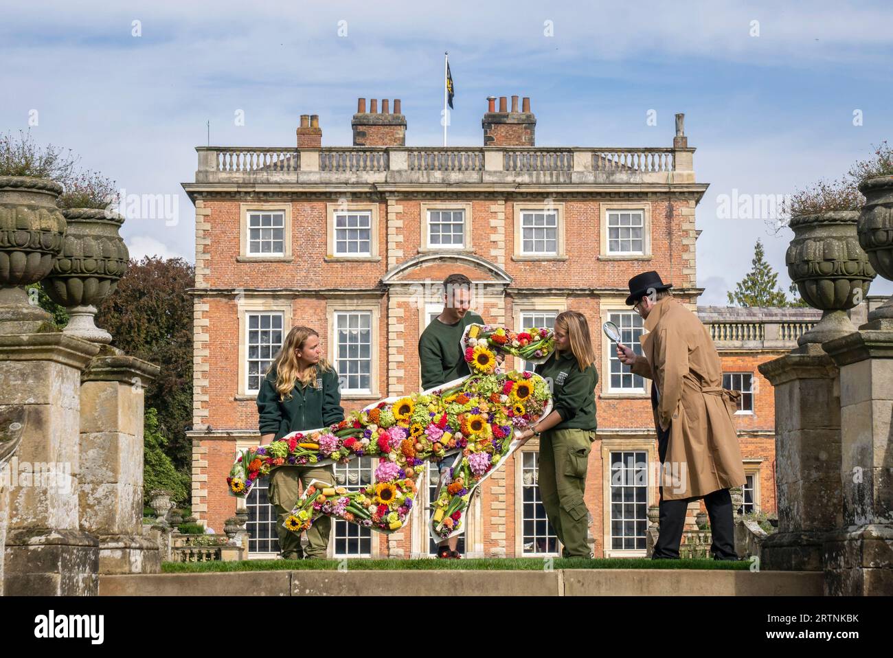 Alexander McDonnell, playing the role of a detective, looks on as ...