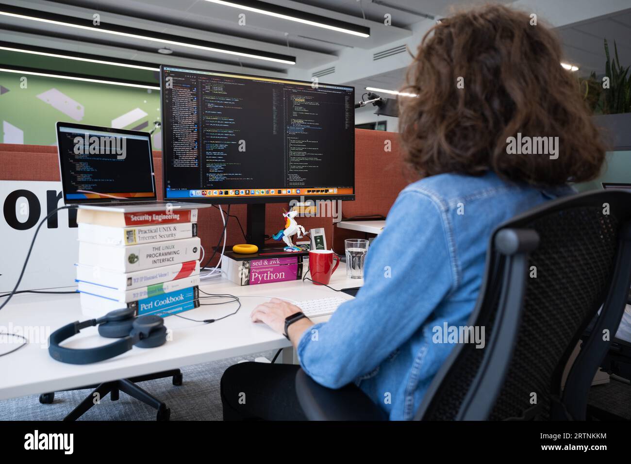 Dresden, Germany. 14th Sep, 2023. An Amazon software developer sits at ...