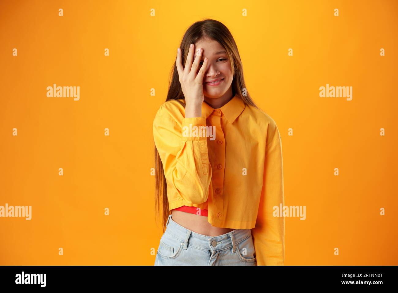 Upset disturbed teen girl on yellow background Stock Photo - Alamy