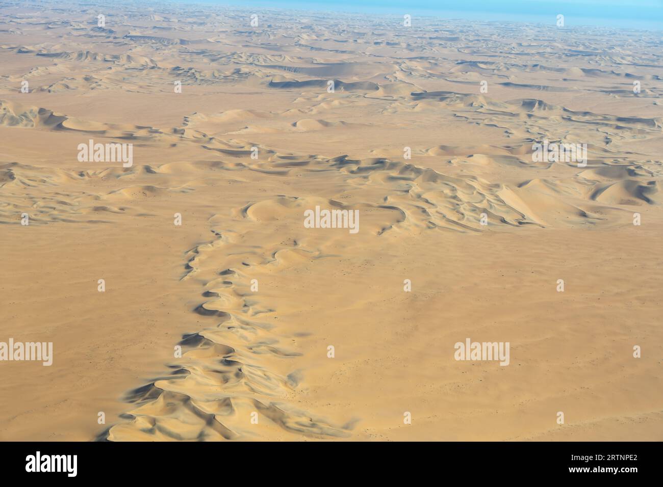 Aerial photography the Namibian coast where the sand dunes meet the ...