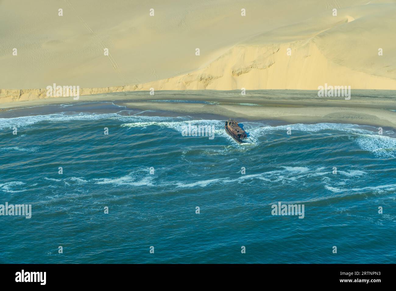 Aerial photography the Namibian coast where the sand dunes meet the Atlantic Ocean, Namibia ...