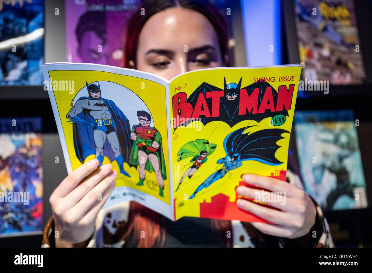 London, UK. 14 September 2023. A staff member with a copy of Bat Man ...