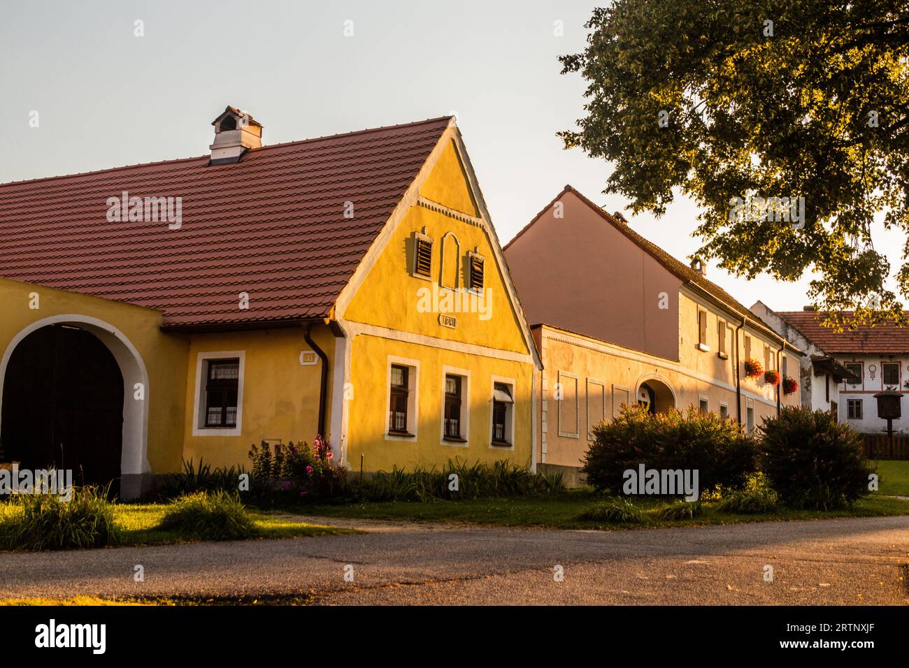 Traditional houses of rural baroque style in Holasovice village, Czech ...