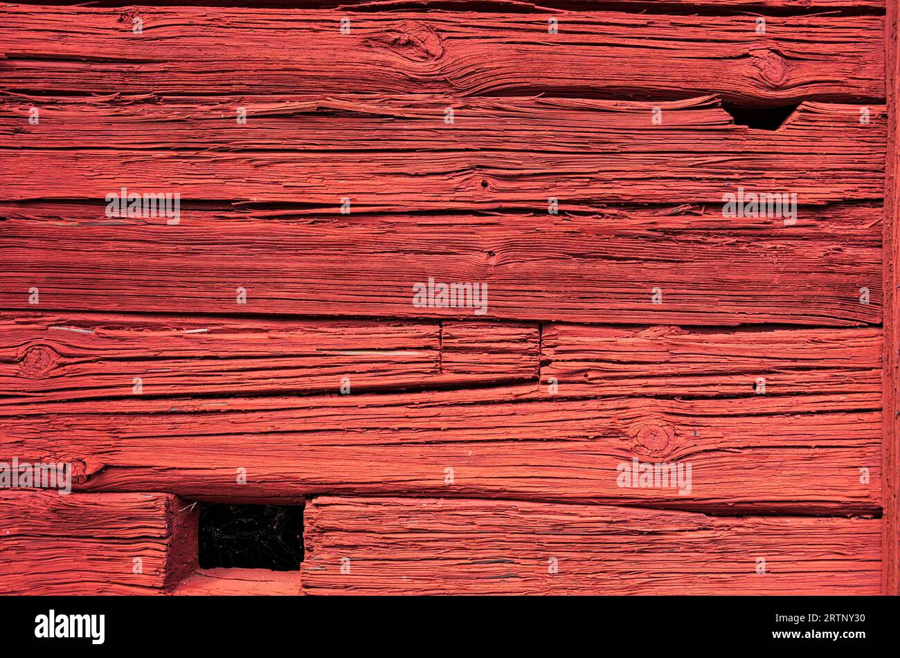 Wooden planks of a traditional rural building in Swedish red, well ...