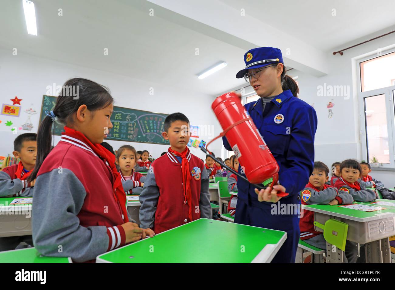 LUANNAN COUNTY, China - November 3, 2021: a female firefighter explains ...